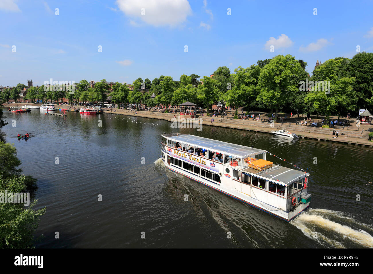 People and boats at the River Dee Embankment, Chester City, Cheshire ...