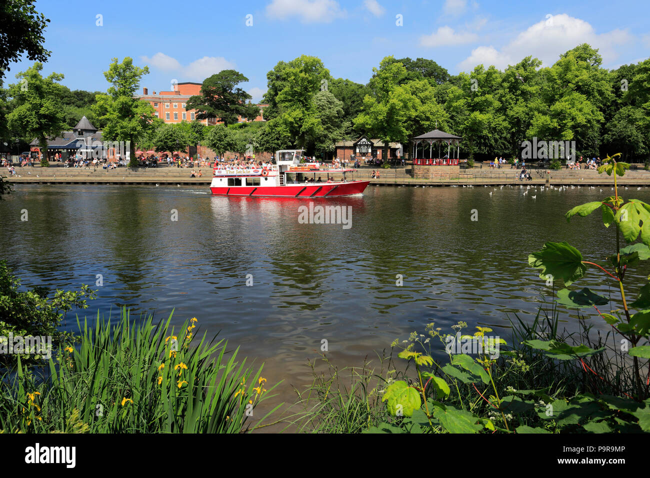 People and boats at the River Dee Embankment, Chester City, Cheshire ...