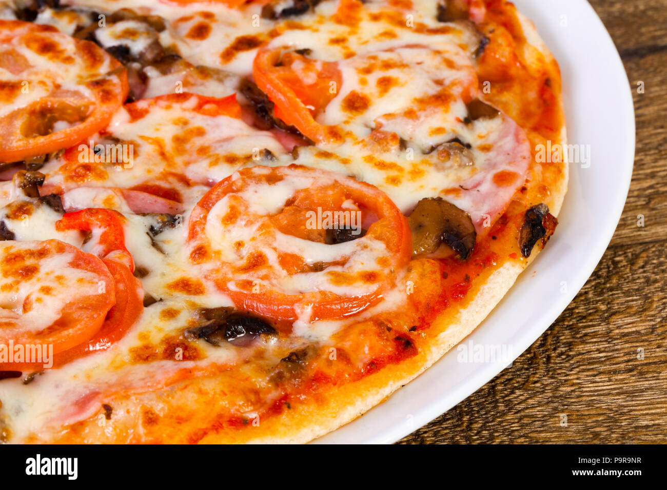 Pizza with ham and cheese Stock Photo - Alamy