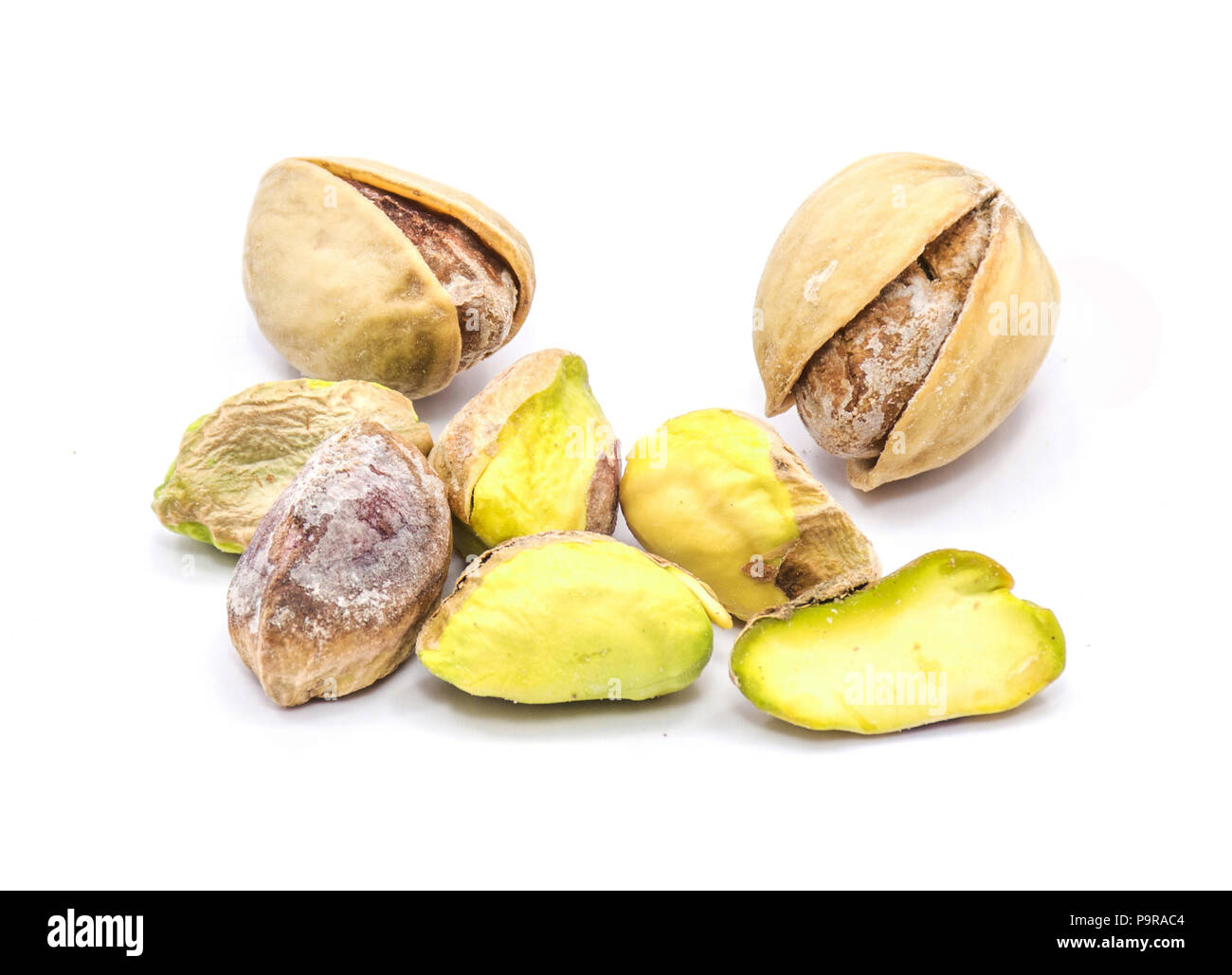 Pistachio nuts isolated on white background, some without shells Stock ...