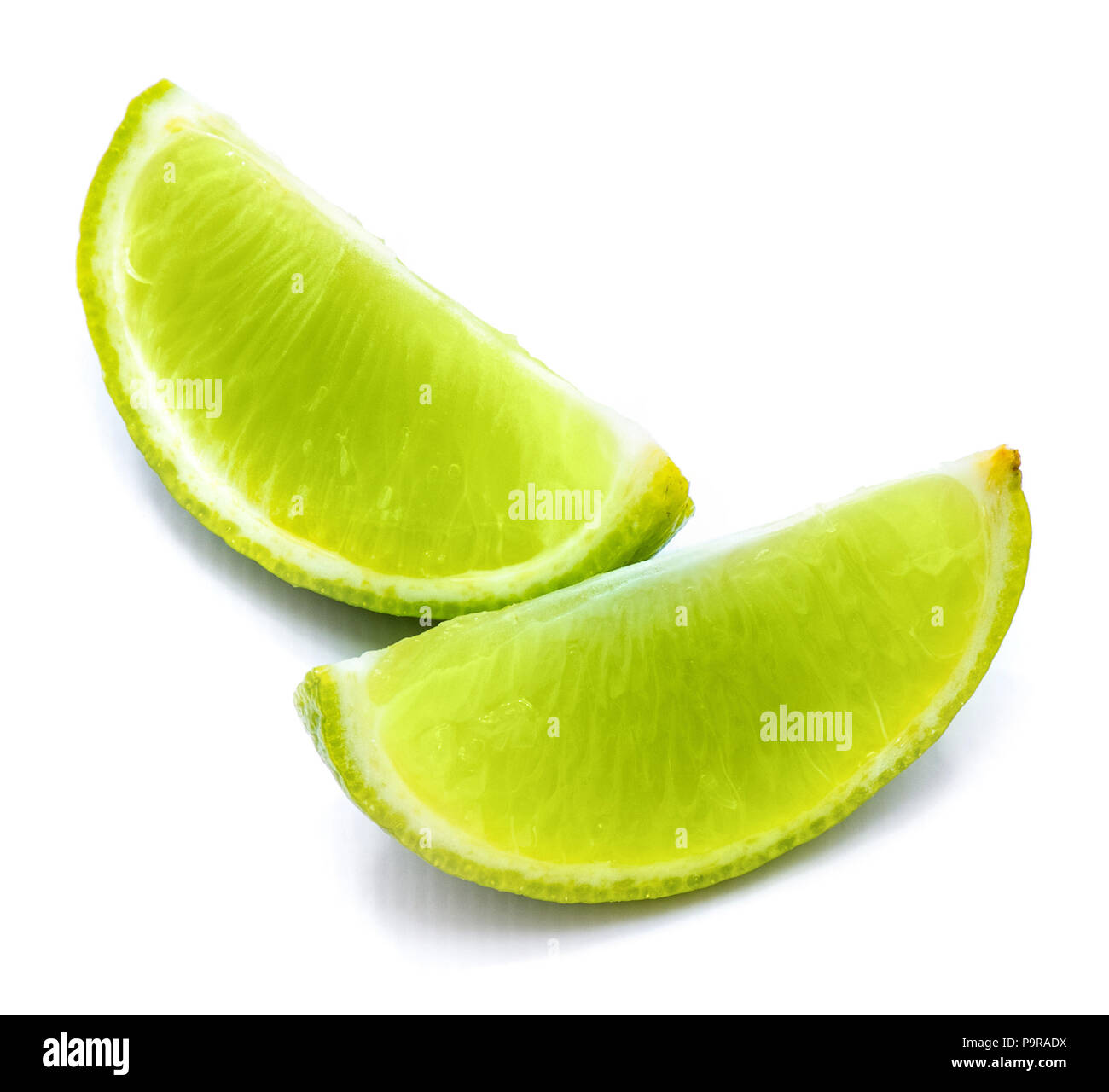 Two lime slices isolated on white studio background Stock Photo - Alamy