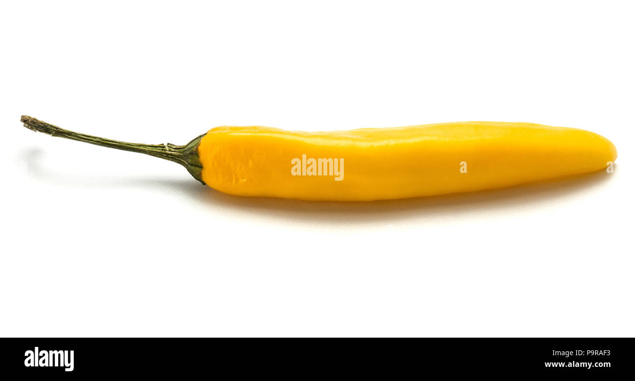 One yellow Chilli isolated on white background Stock Photo - Alamy