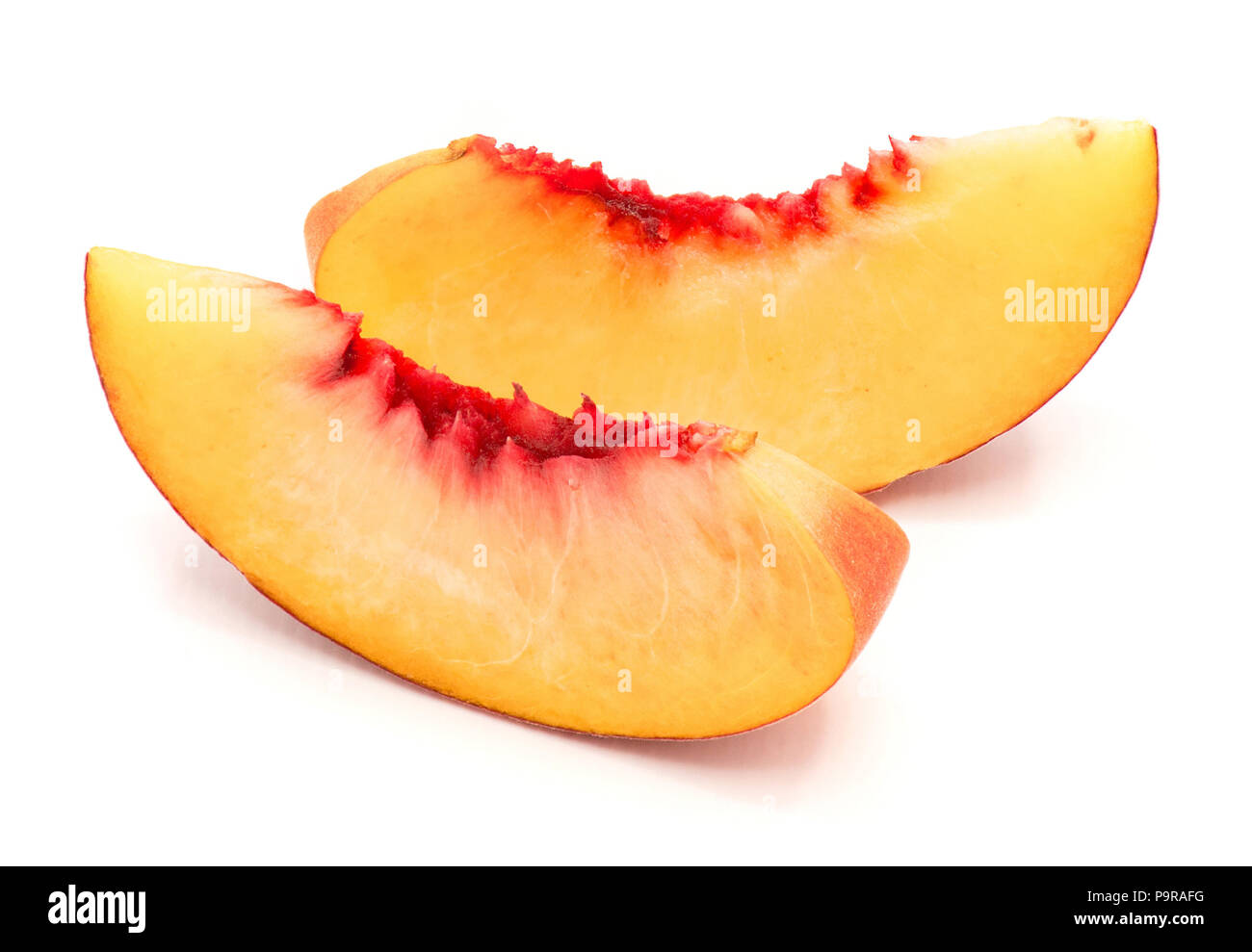 Two peach slices isolated on white background Stock Photo - Alamy
