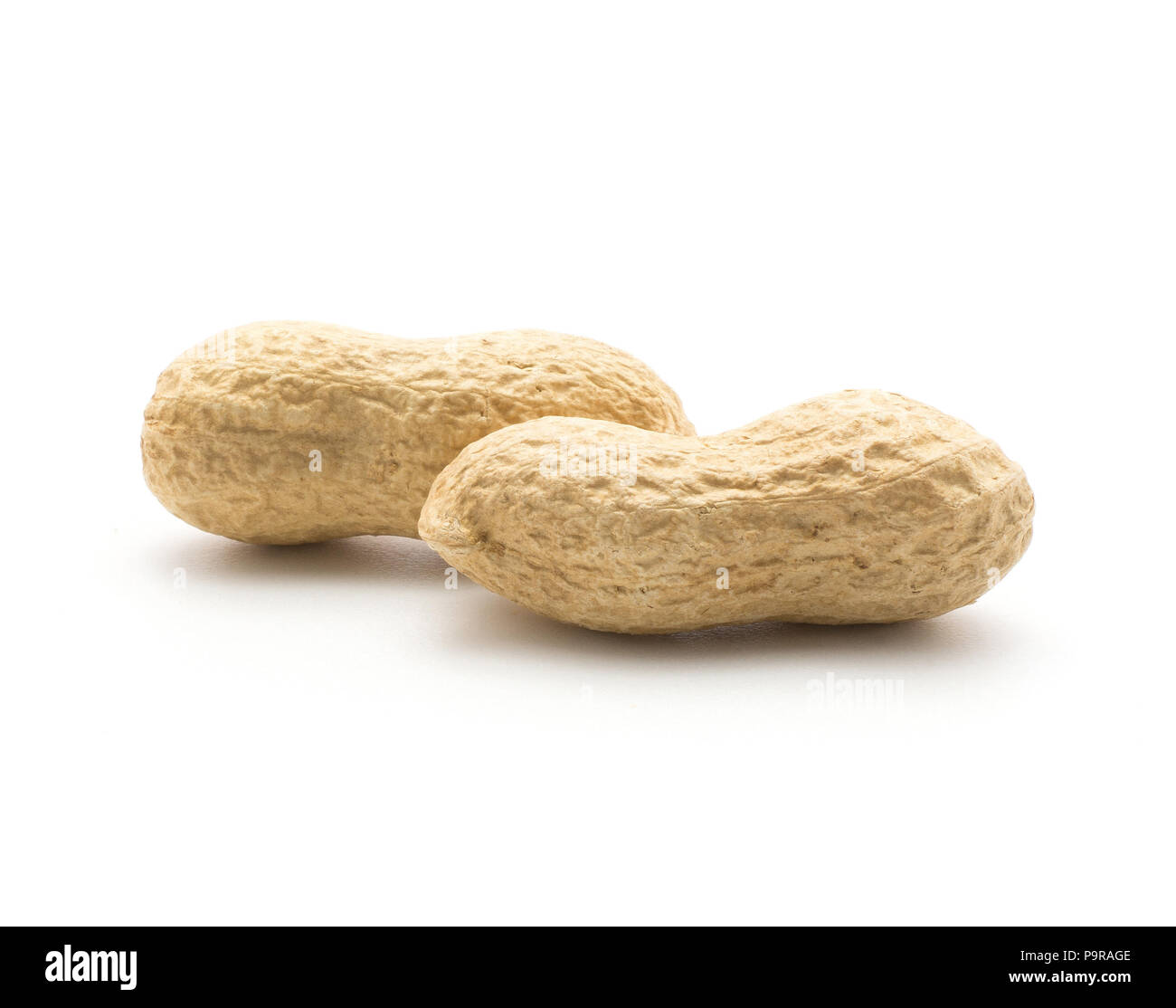 Unshelled peanuts isolated on white background two raw Stock Photo - Alamy