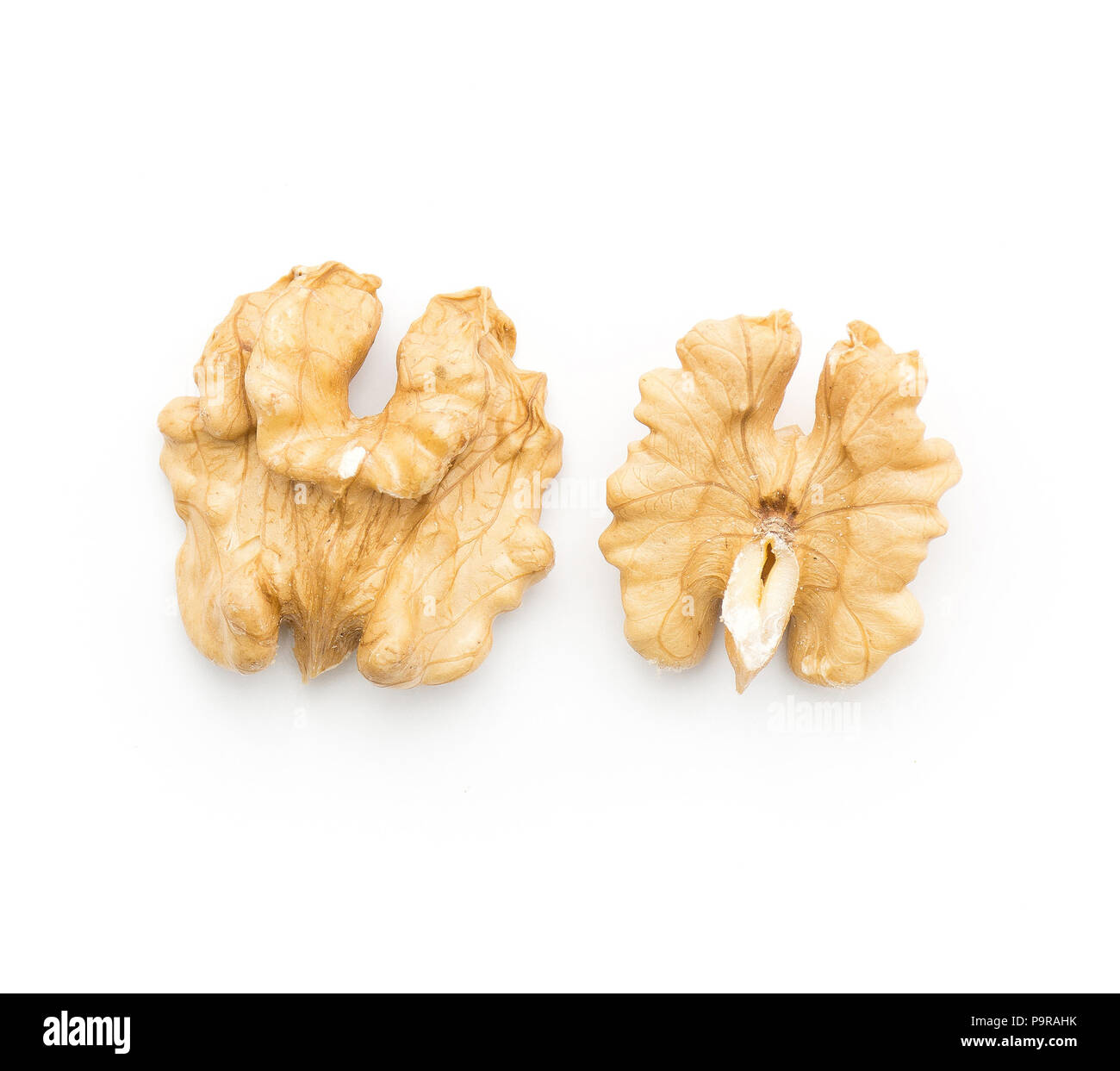 Two shelled walnuts top view isolated on white background Stock Photo ...