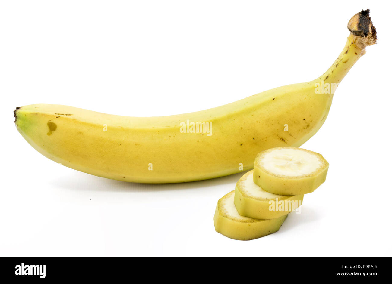 One whole yellow banana, round slices isolated on white background ...