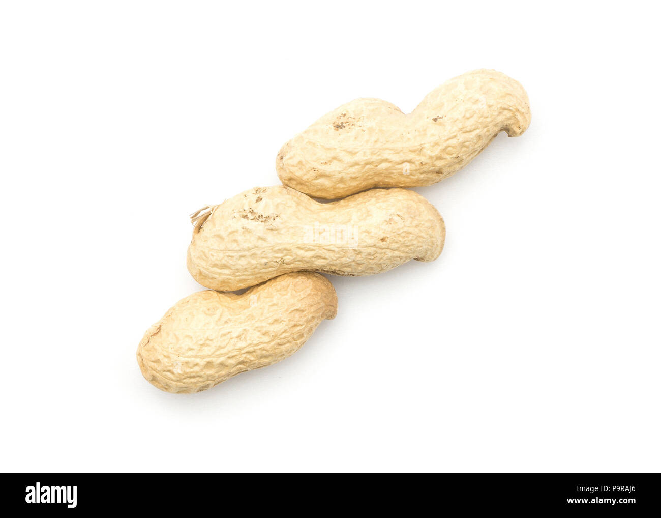 Three unshelled peanuts top view isolated on white background Stock ...