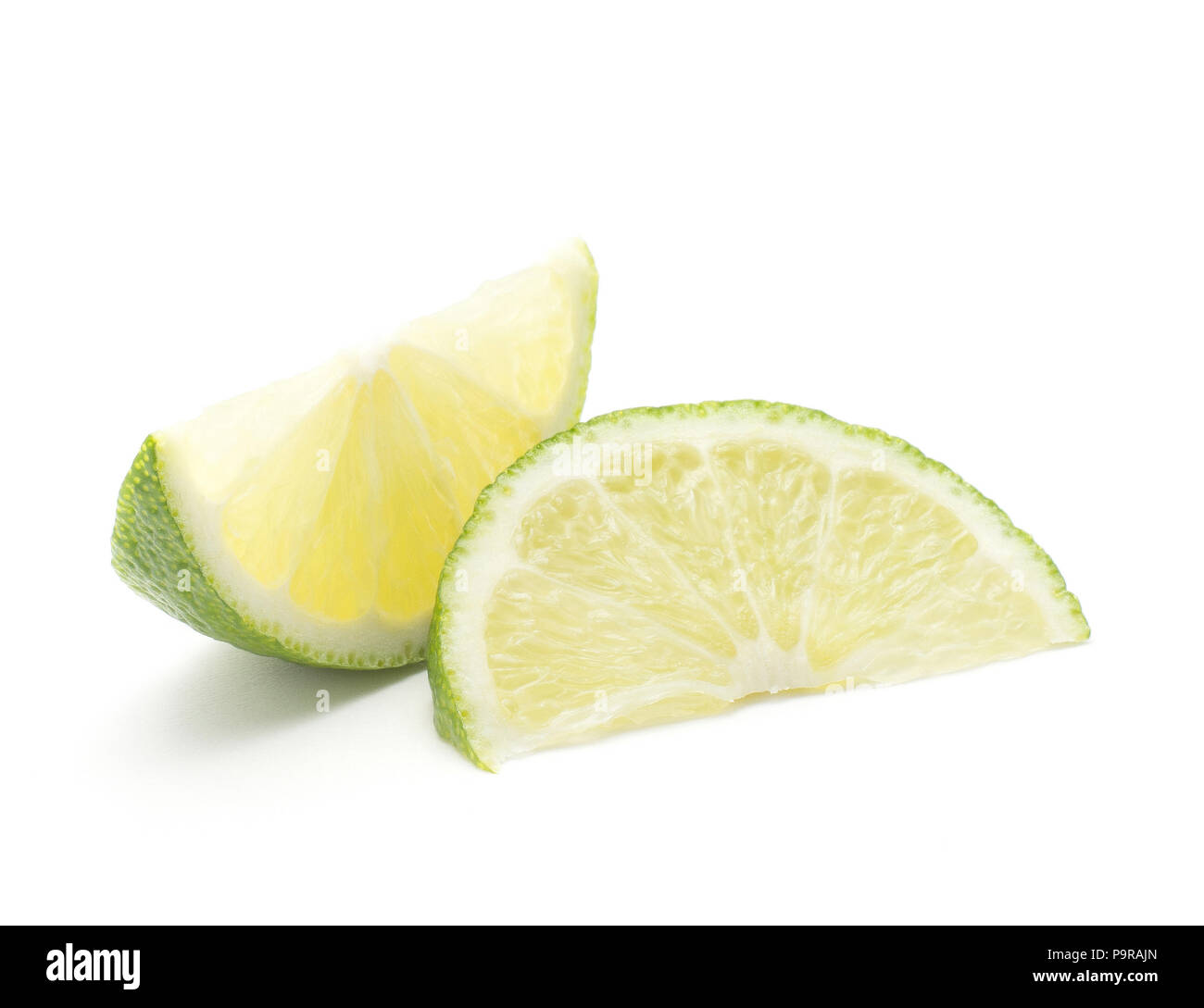 Two lime slices isolated on white background Stock Photo - Alamy