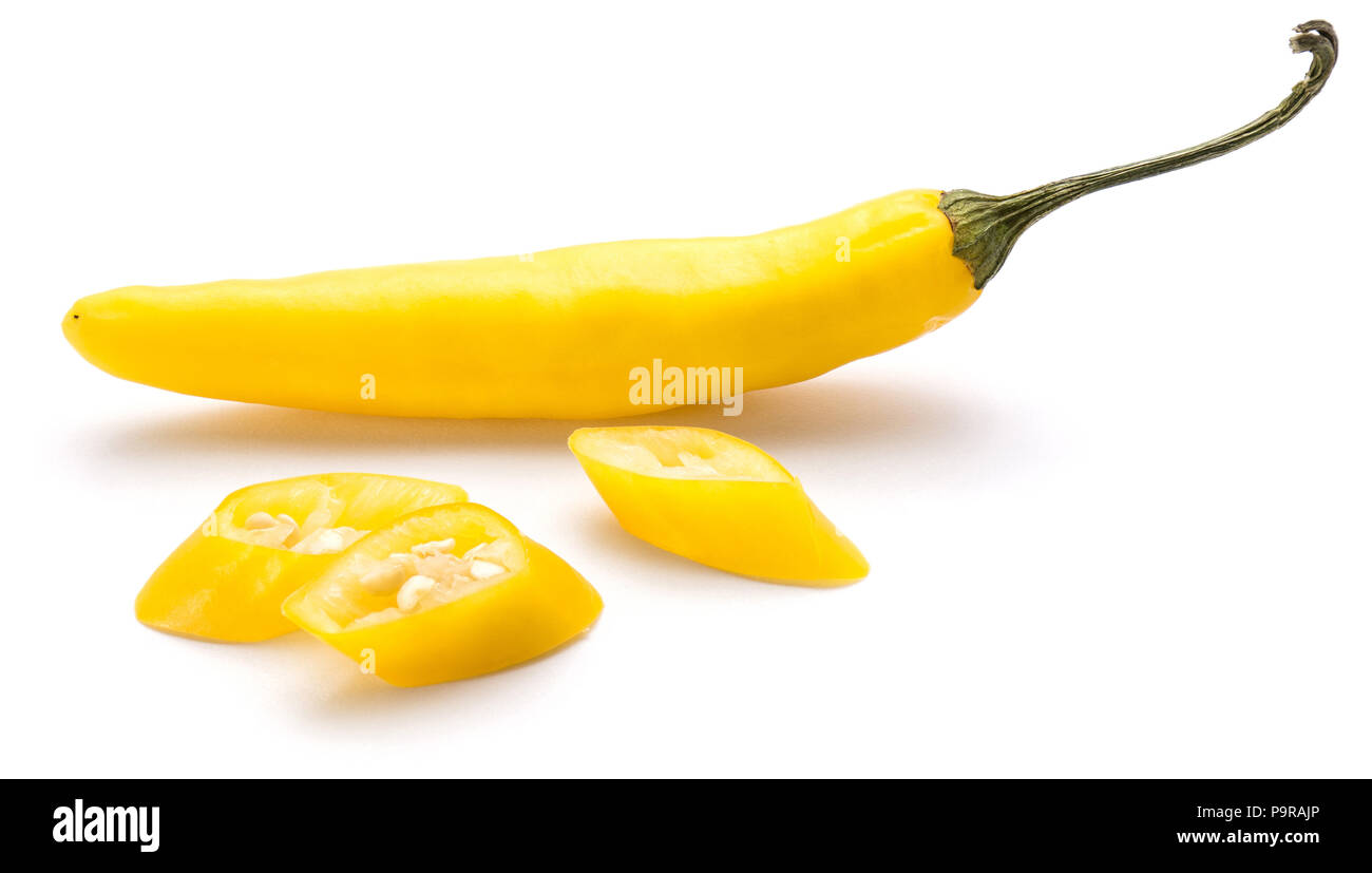 One whole yellow Chili pepper and three slices isolated on white ...