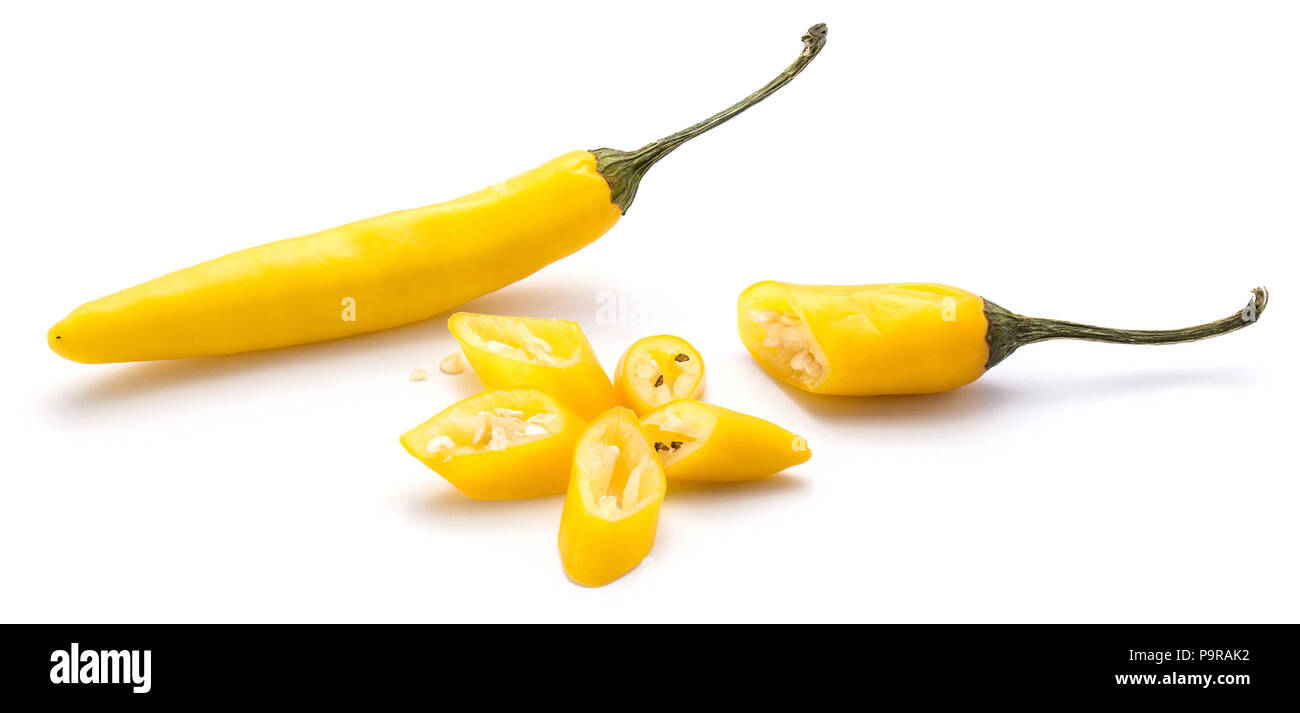 One whole yellow Chili pepper and slices in shape of flower isolated on ...