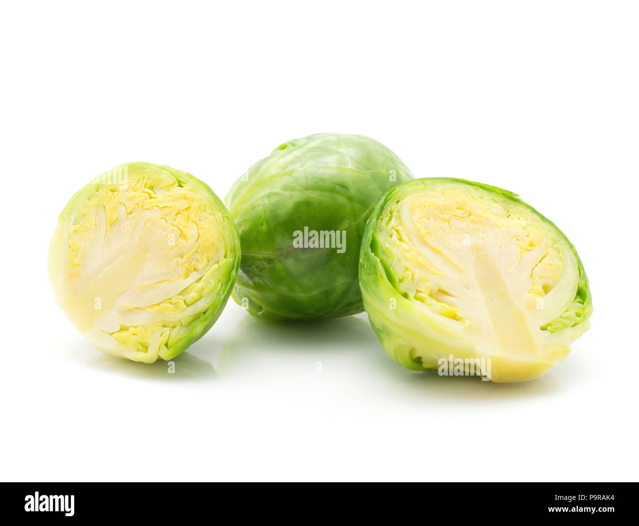 Boiled Brussels sprout isolated on white background one head and two ...