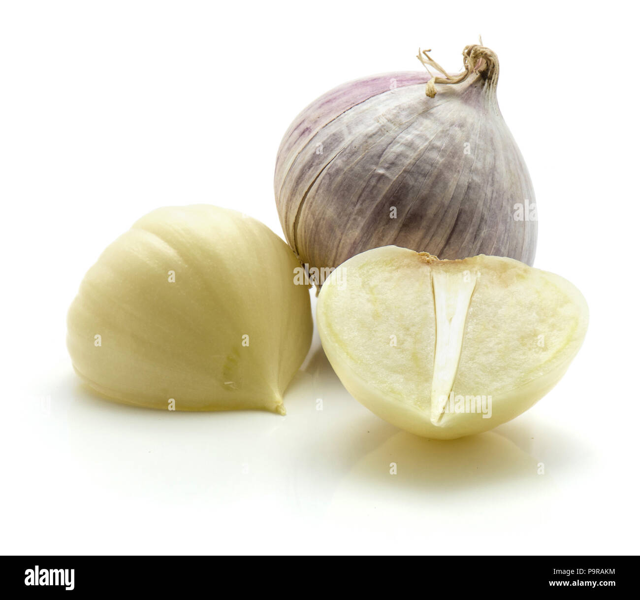 One whole solo garlic and two sliced halves isolated on white ...