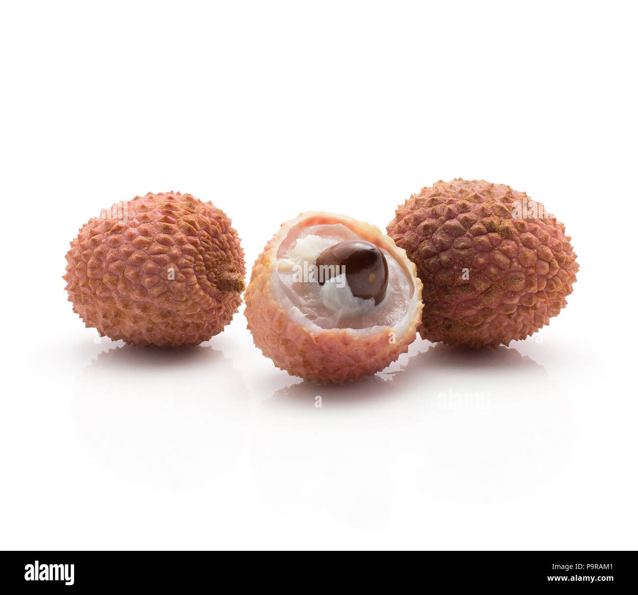 Three lychee one peel with brown seed isolated on white background ripe ...