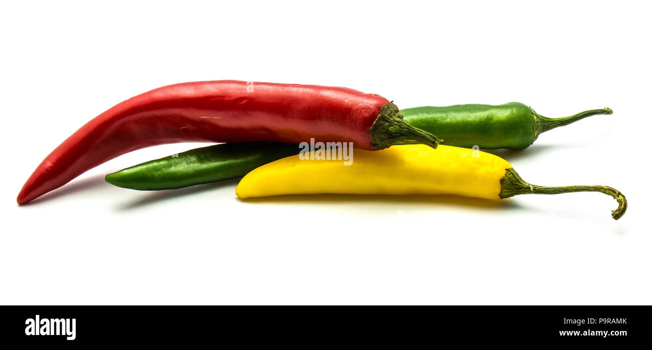 Red, green and yellow Cayenne Chili peppers isolated on white ...