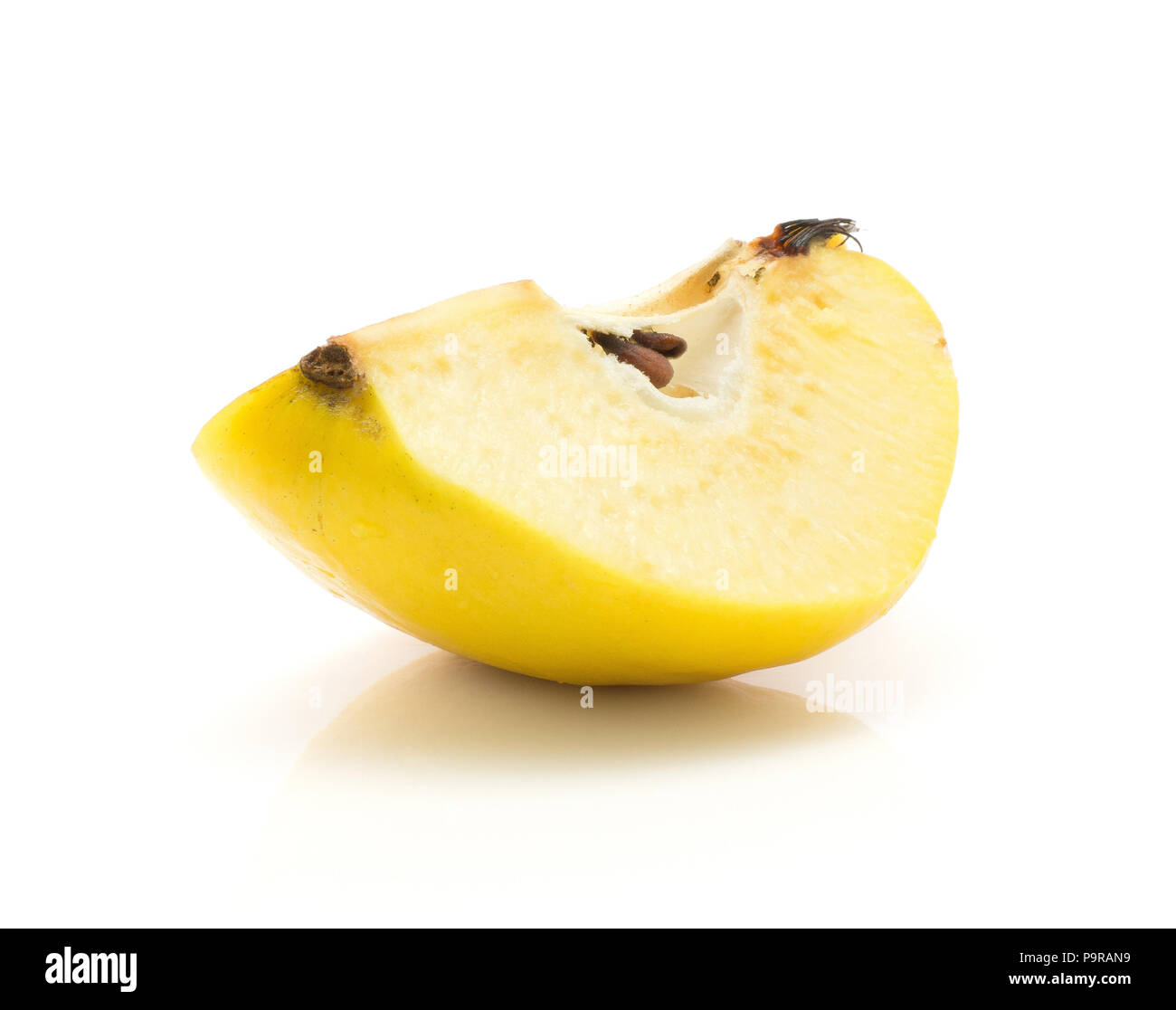 One yellow quince slice isolated on white background raw ripe Stock ...