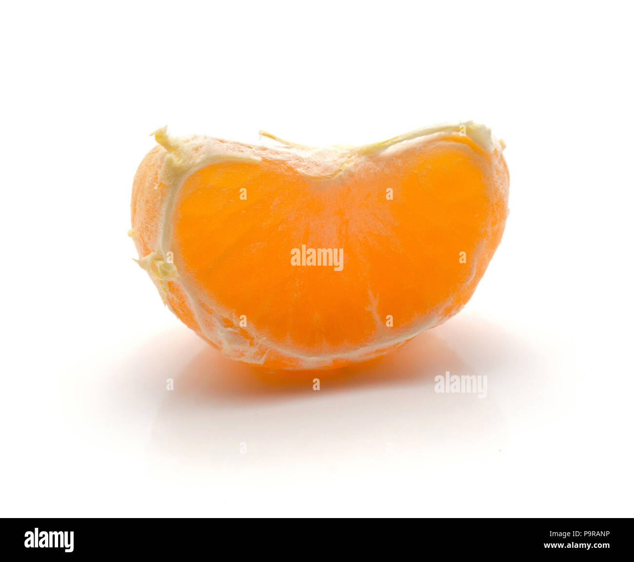 One tangerine segment isolated on white background Stock Photo - Alamy