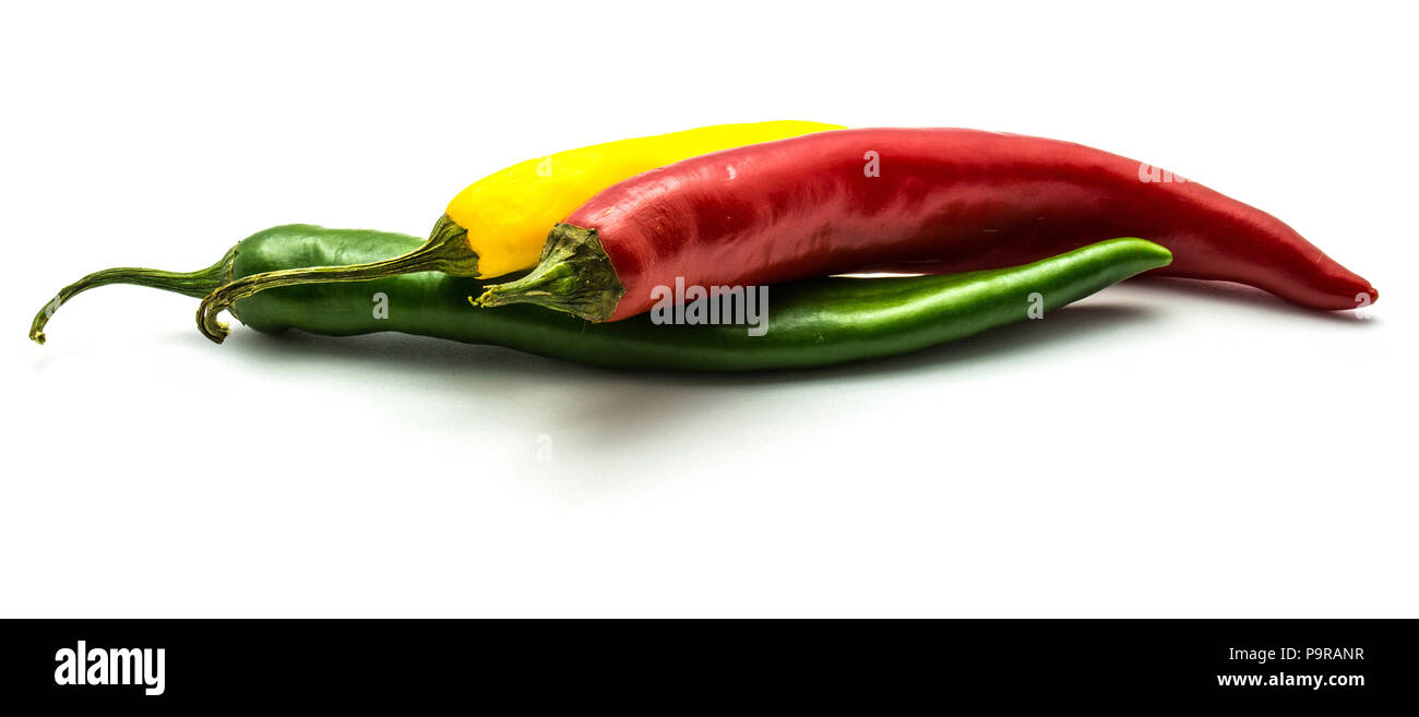 Red, green and yellow Cayenne Chili peppers isolated on white ...