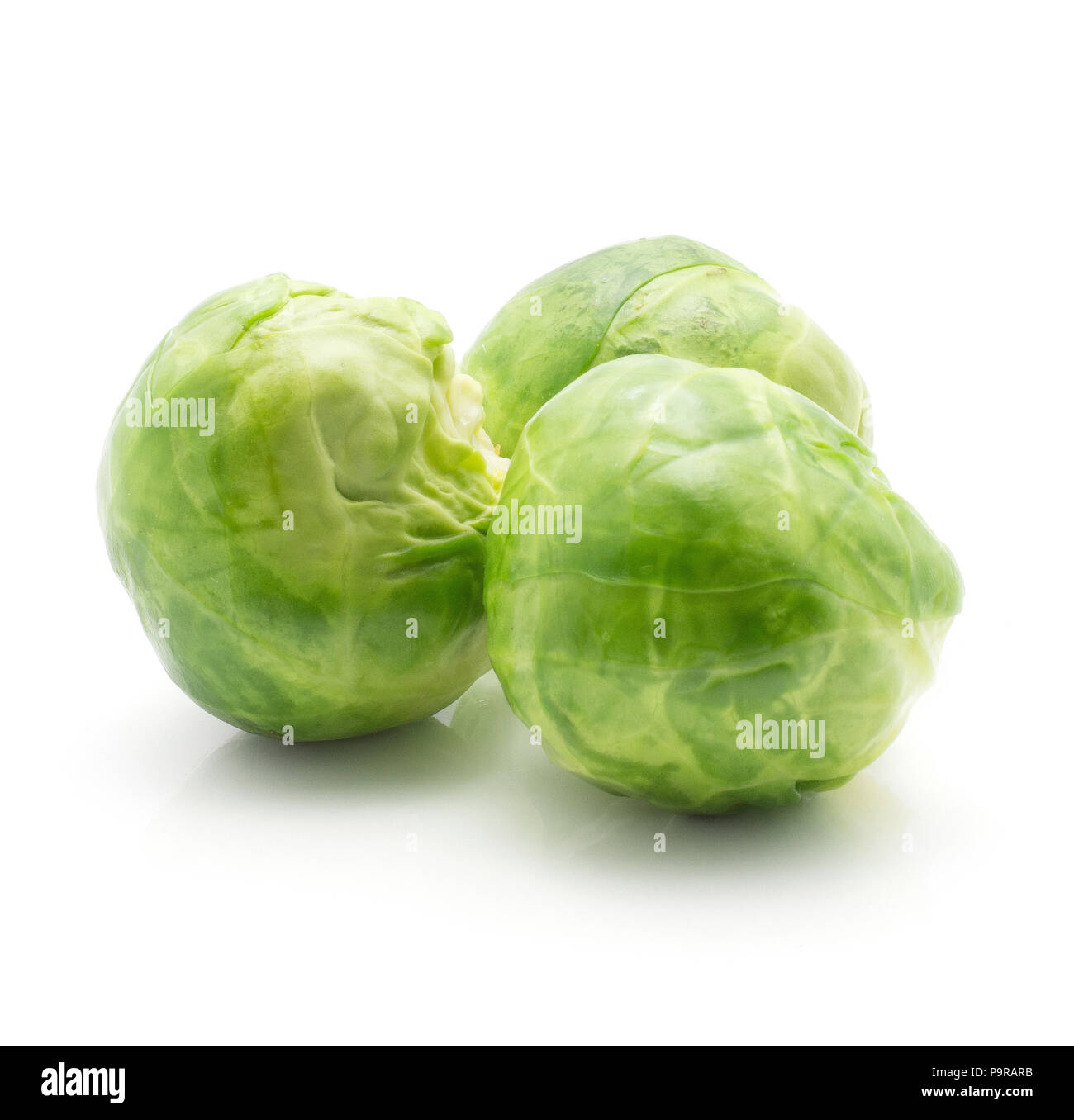 Boiled Brussels sprout isolated on white background three whole heads ...
