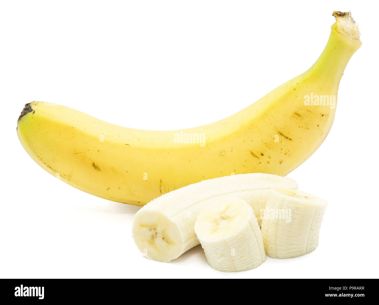 One whole banana and sliced pieces isolated on white background Stock ...