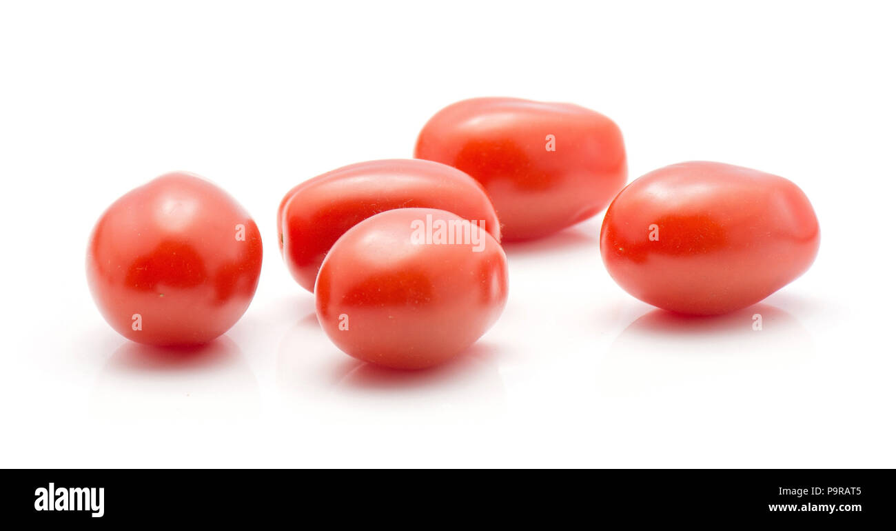 Five cherry tomatoes isolated on white background Stock Photo - Alamy