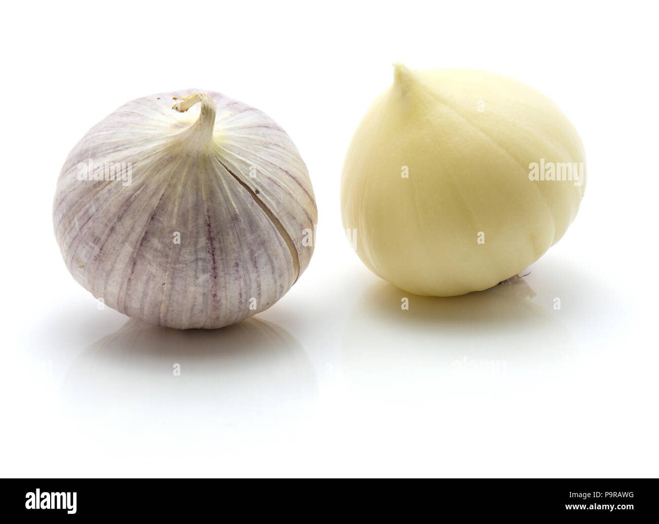 Two bulbs of solo garlic isolated on white background one bulb peeled ...