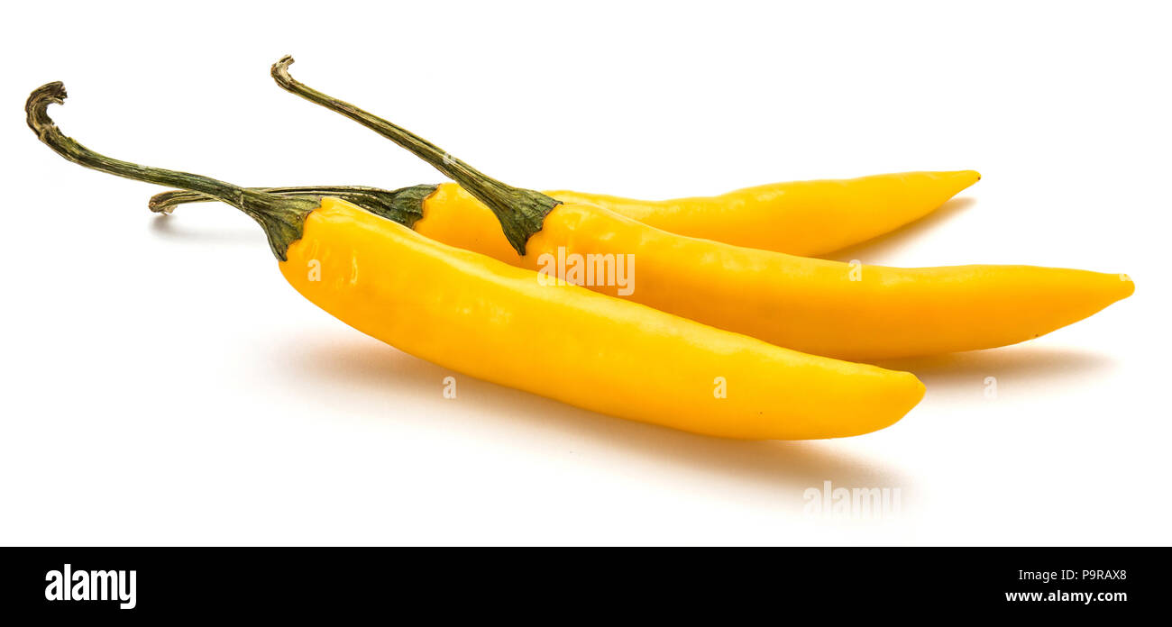 Three yellow Chili pepper isolated on white background Stock Photo - Alamy
