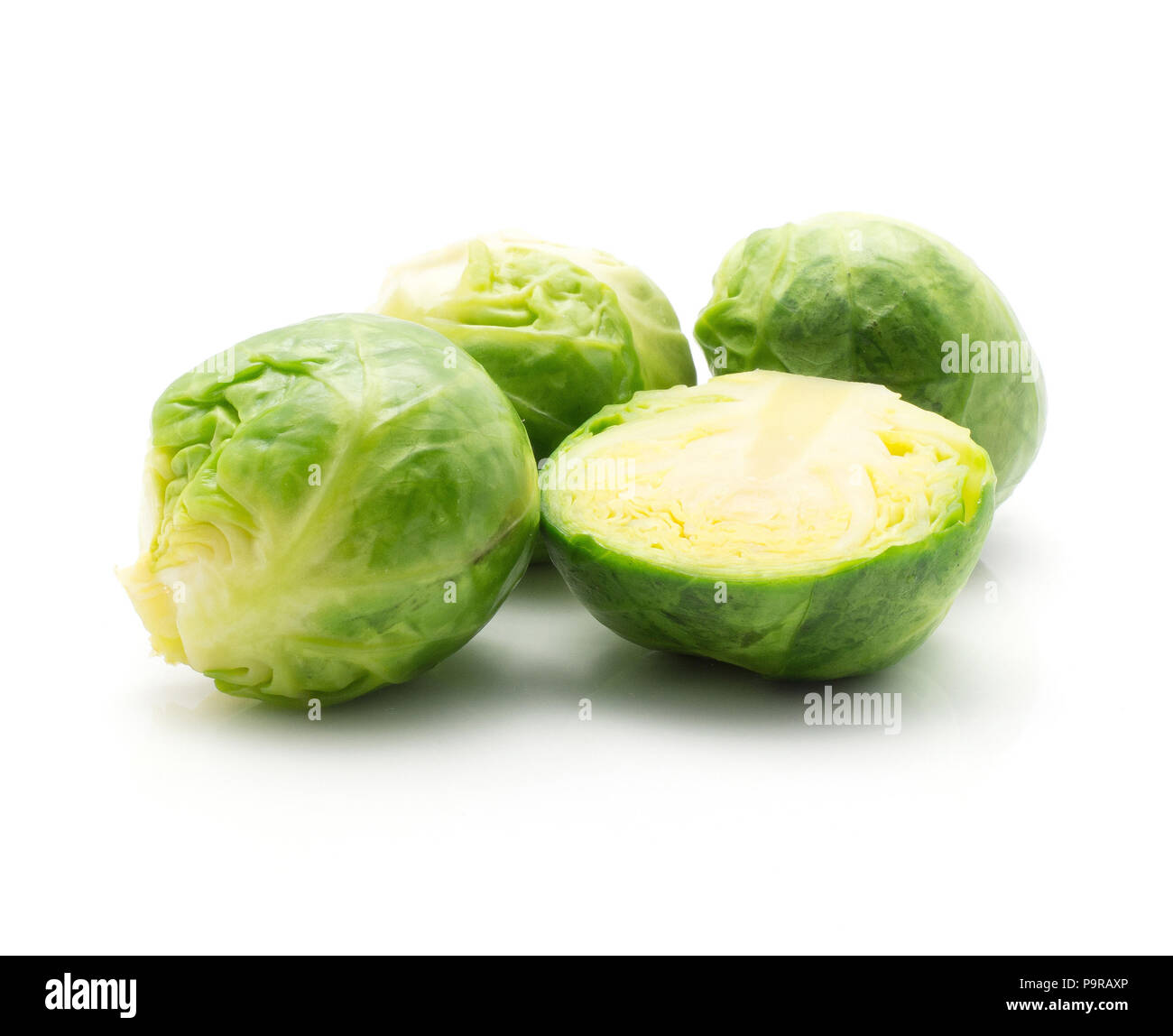 Boiled Brussels sprout three heads and one half isolated on white ...