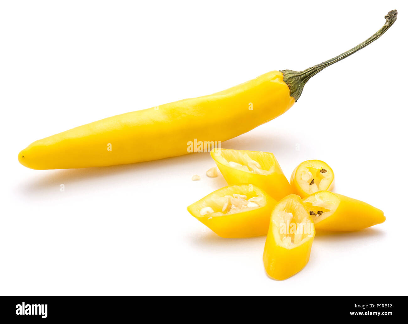 One whole yellow Chili pepper and slices in shape of flower isolated on ...