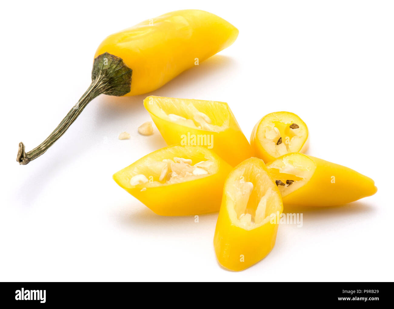 Sliced yellow Chili pepper composition isolated on white background ...