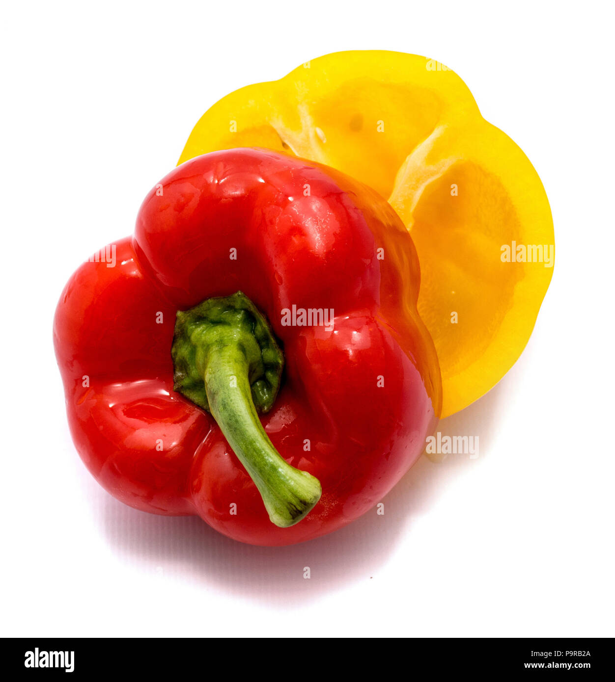 Cut red and yellow pepper pieces isolated on white background Stock ...