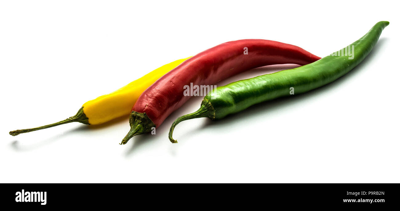 Red, green and yellow Cayenne Chili peppers isolated on white ...