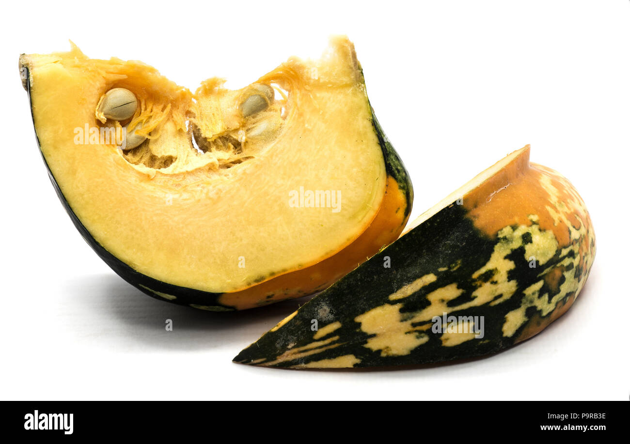 Two spotty green yellow pumpkin slices with seeds isolated on white ...