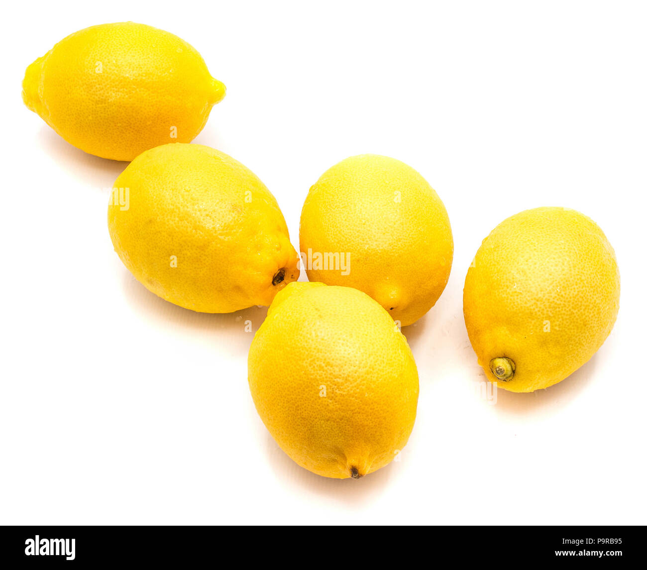 Composition of five whole yellow lemons isolated on white background ...