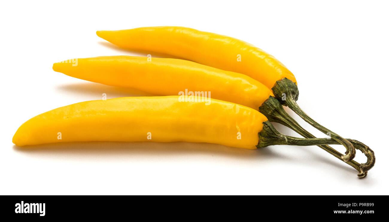 Three yellow Chili pepper isolated on white background Stock Photo - Alamy