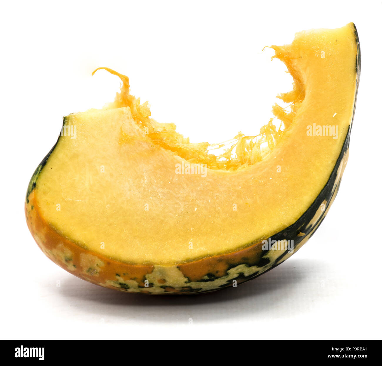 One spotty green yellow pumpkin slice with seeds isolated on white ...