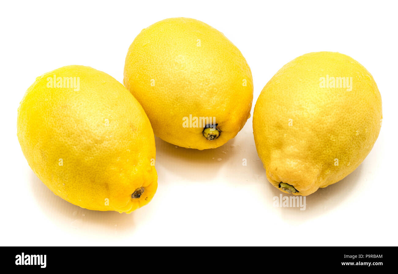 Three yellow lemons isolated on white background Stock Photo - Alamy