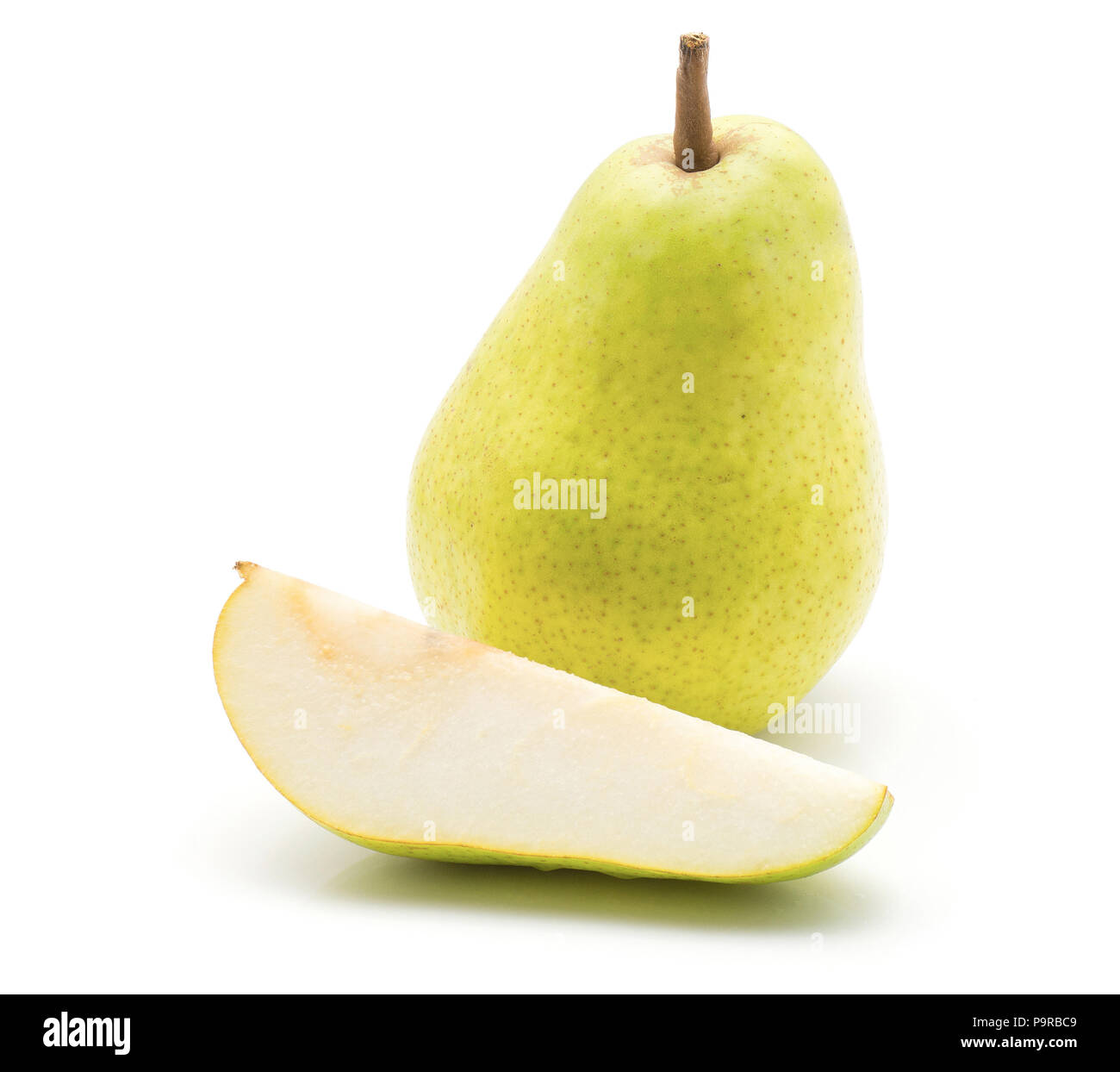 Green pear and one slice isolated on white background Stock Photo - Alamy