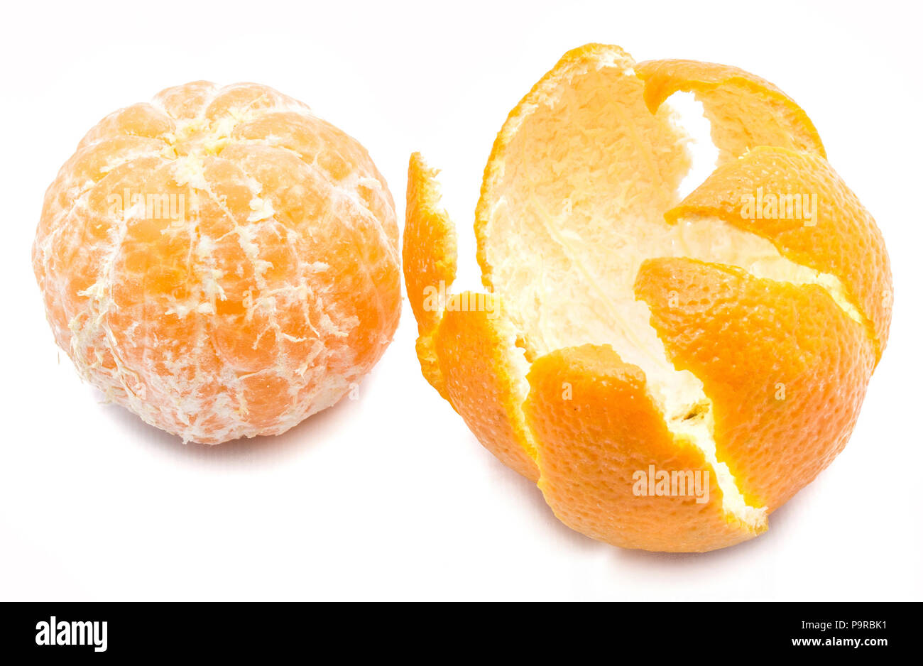 One whole peeled Clementine and separated rind isolated on white ...