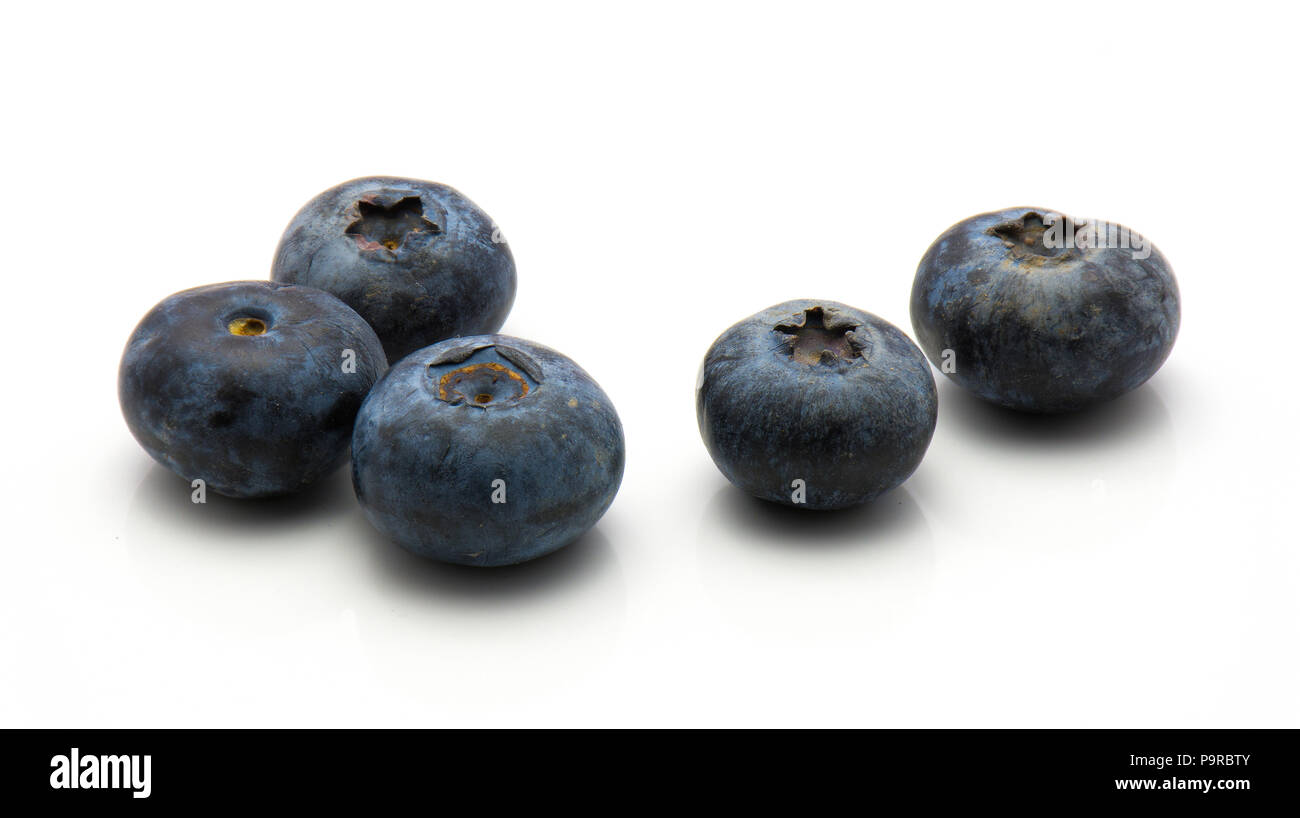 Five bog blueberries isolated on white background Stock Photo - Alamy