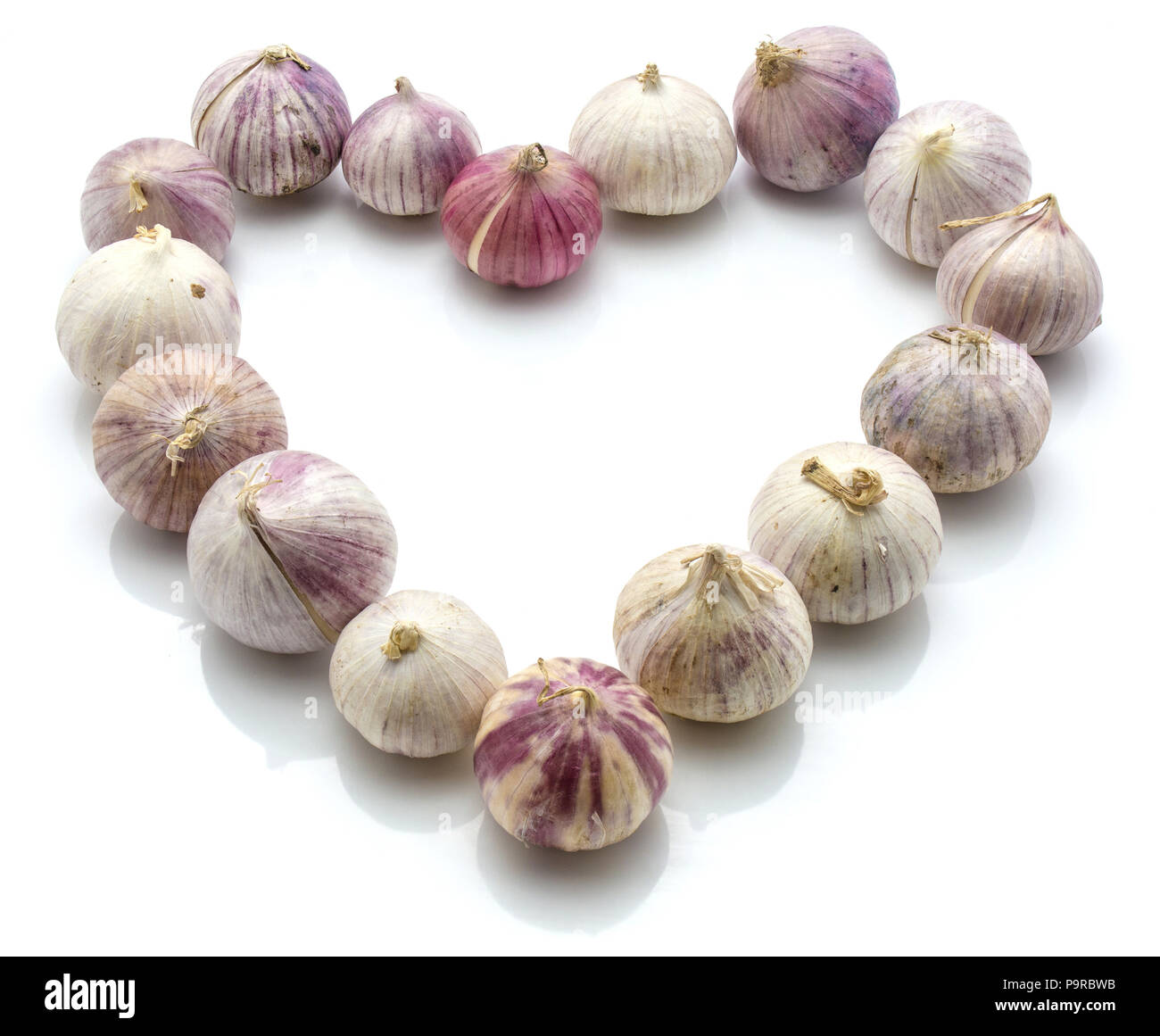 Solo garlic heart isolated on white background Stock Photo - Alamy