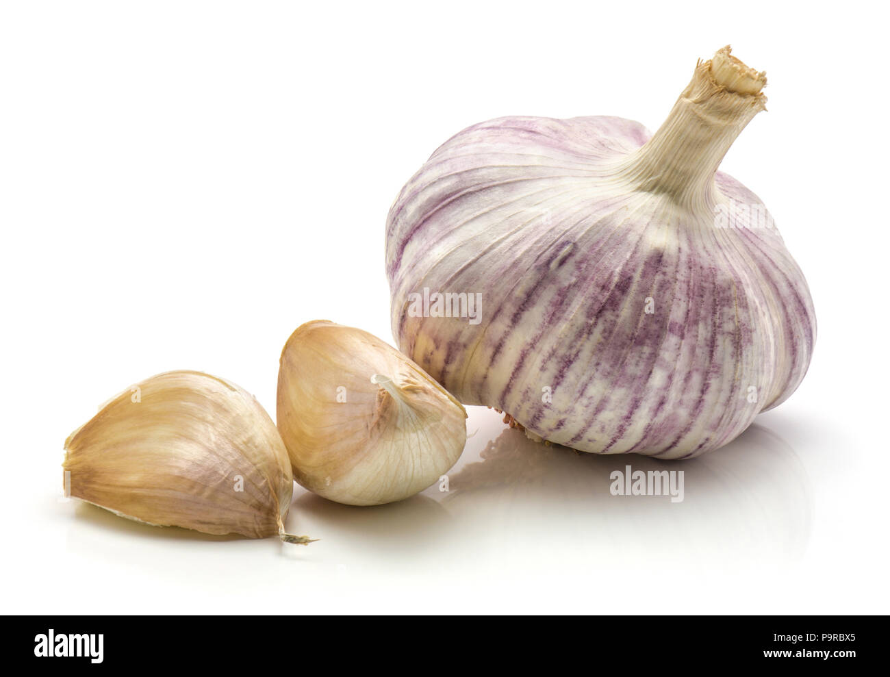One whole garlic and two cloves isolated on white background Stock ...