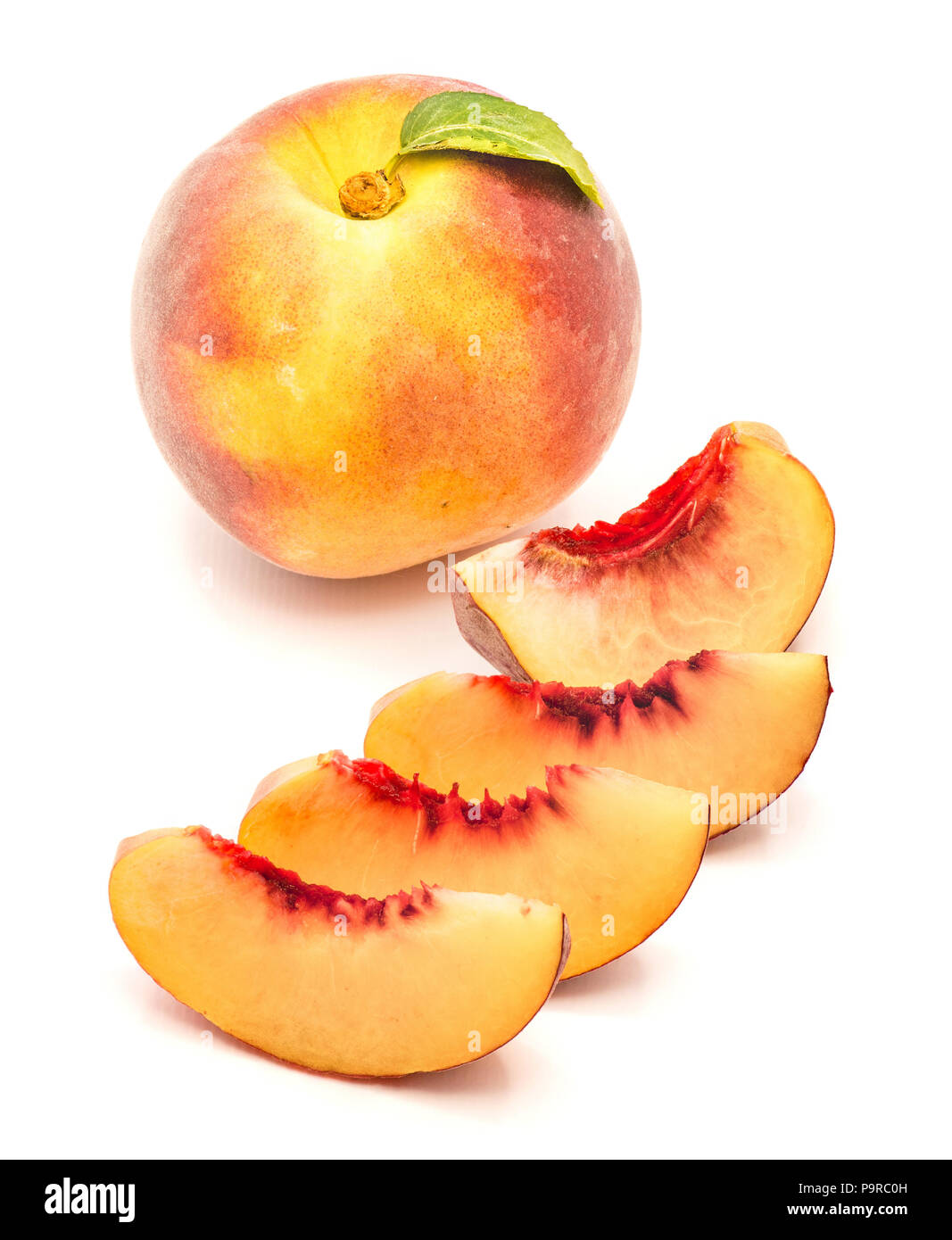 Sliced one whole peach with a green leaf and four slices, isolated on ...