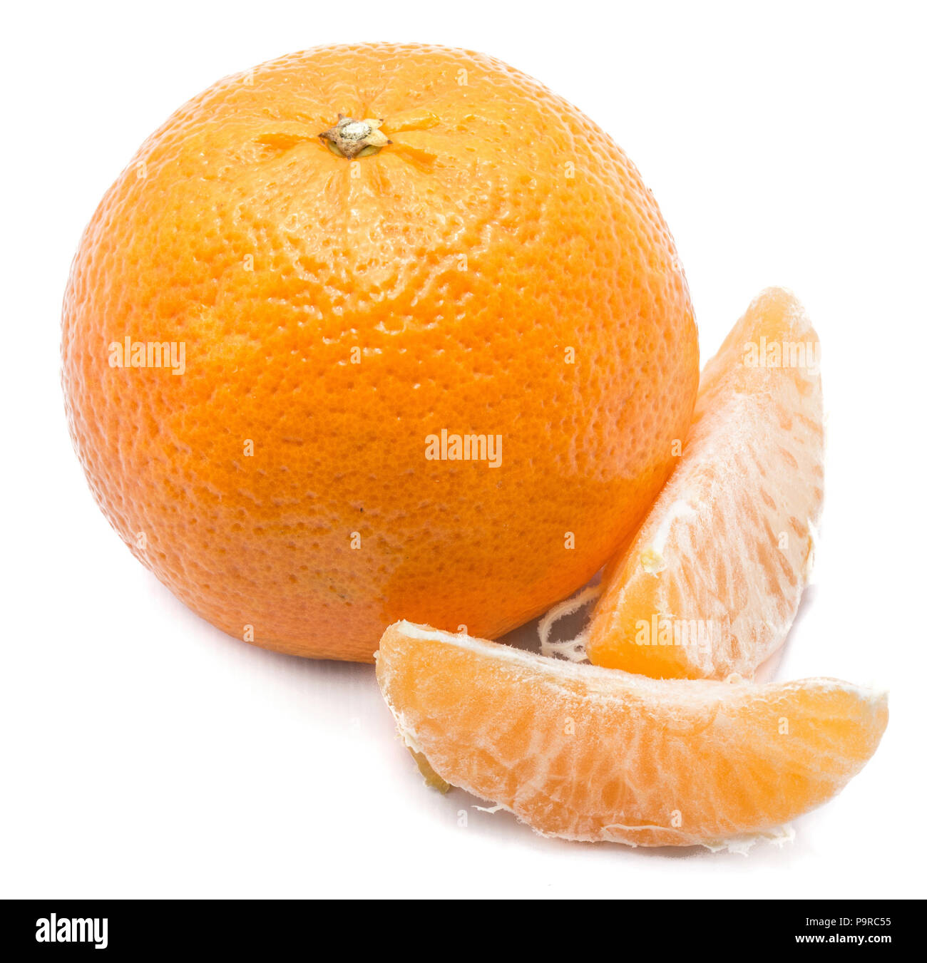 One whole Clementine and two peeled segments isolated on white ...