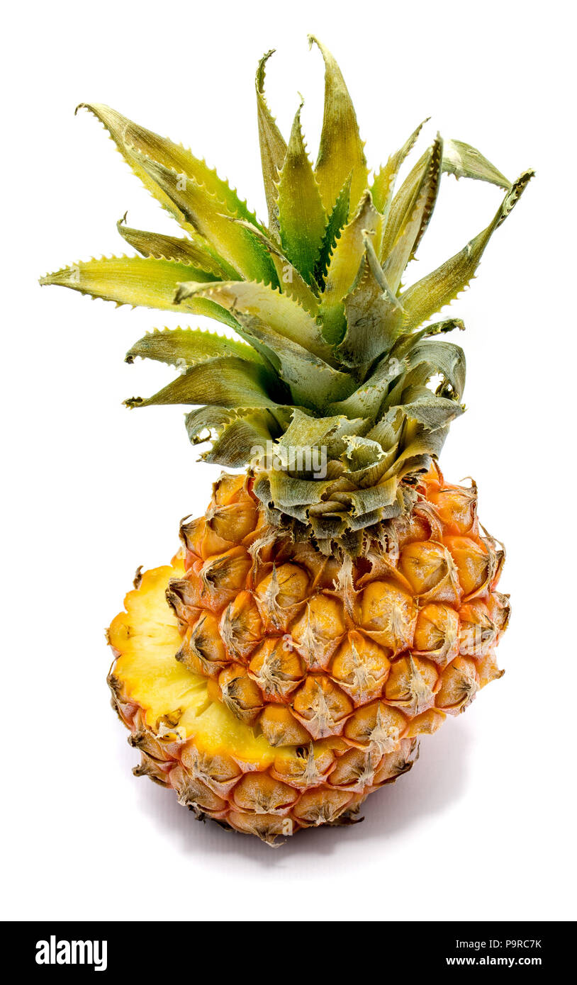 Two pineapple halves isolated on white background Stock Photo - Alamy