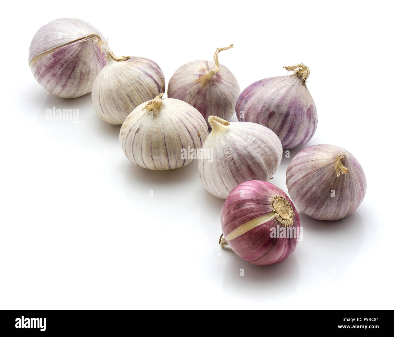 Group of solo garlic isolated on white background Stock Photo - Alamy