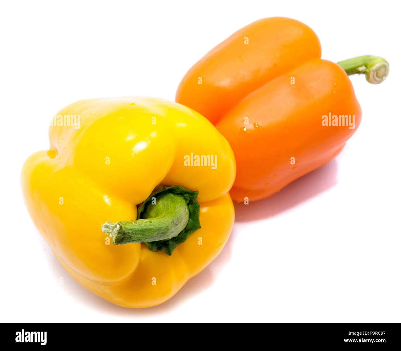 Group of peppers, yellow and orange pepper, isolated on white ...