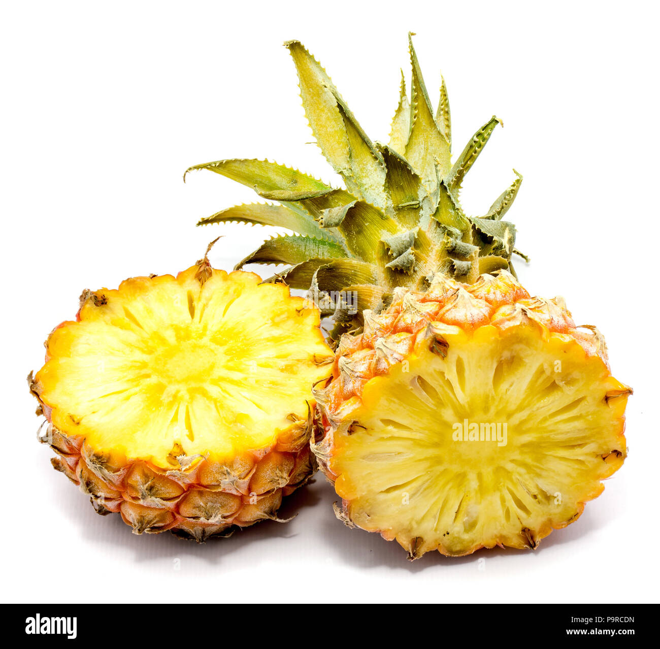 Two pineapple halves isolated on white background Stock Photo - Alamy