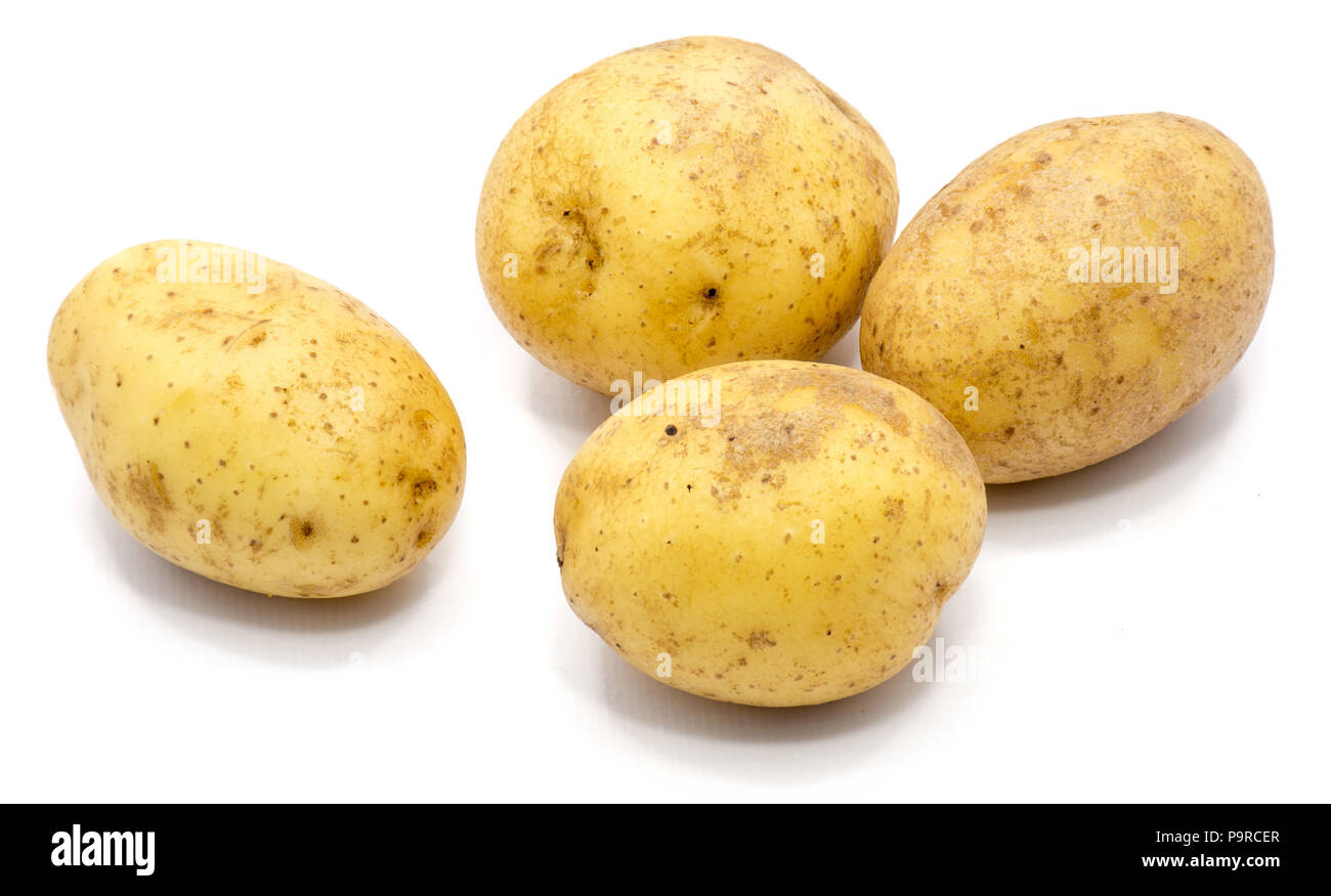 Four whole potatoes isolated on white background Stock Photo - Alamy