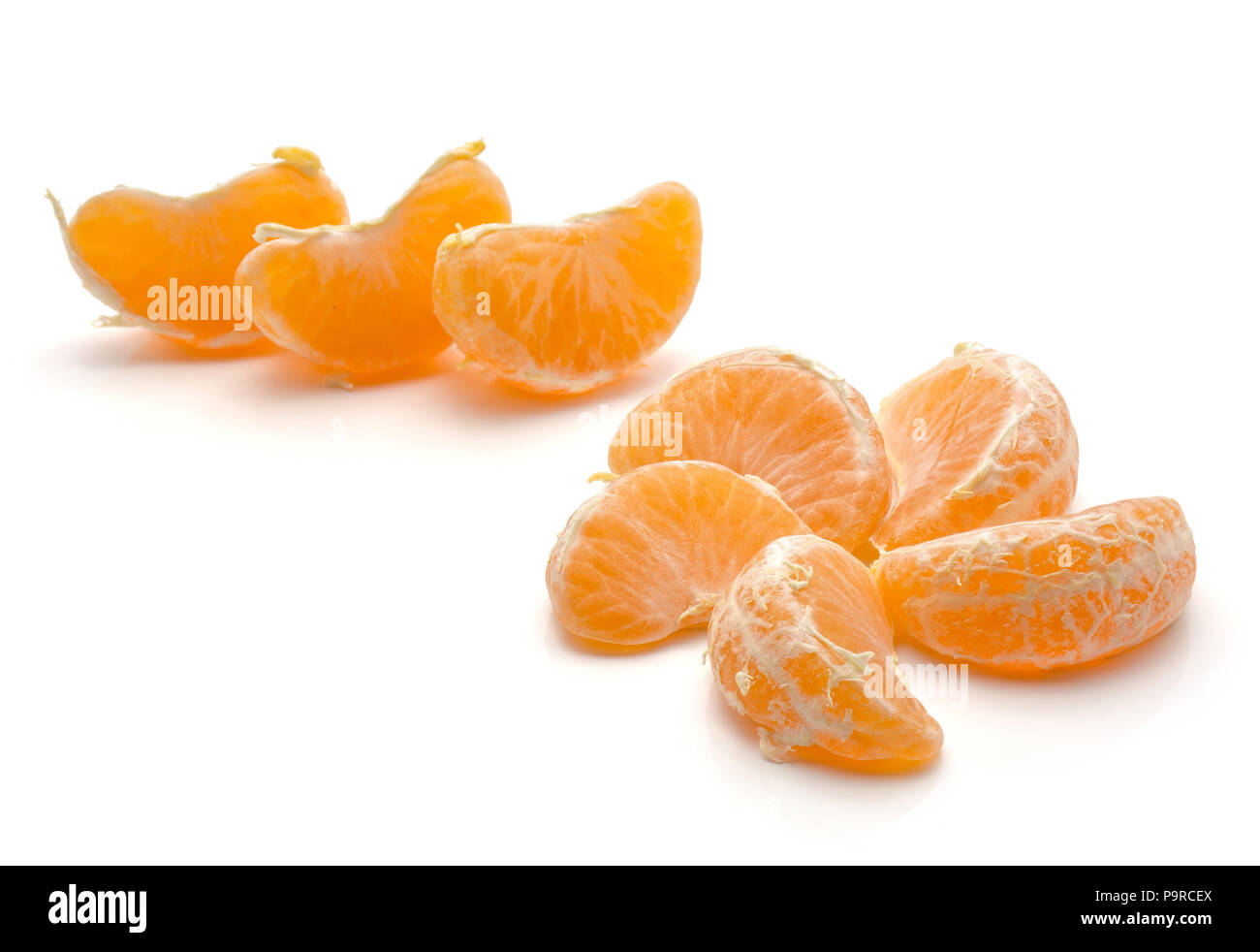 Tangerine segments gathered in flower and in row isolated on white ...