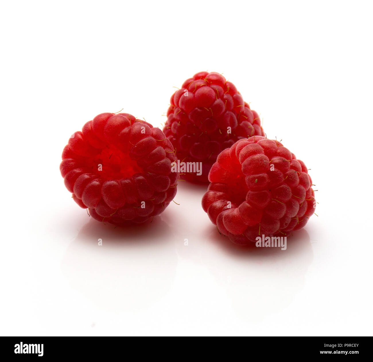 Red raspberries isolated on white background three fresh Stock Photo ...
